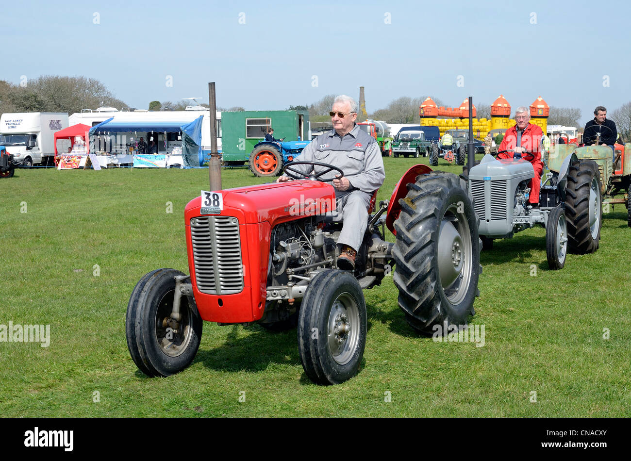 A vintage tractor parade at a country fair near Redruth in Cornwall, uk ...