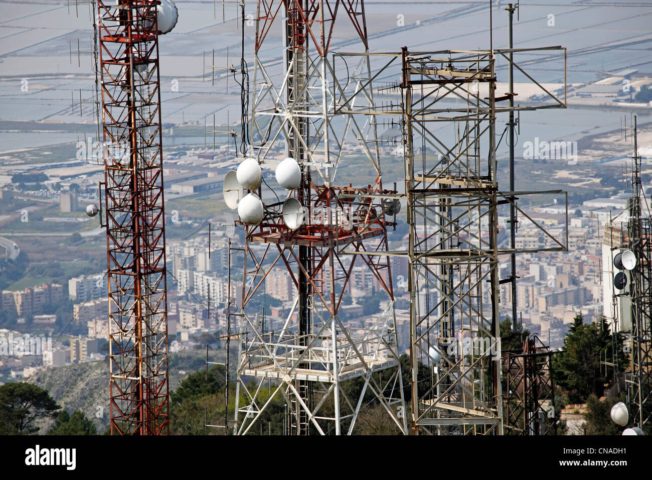 Telecommunications tower with telephone communications dishes on the ...