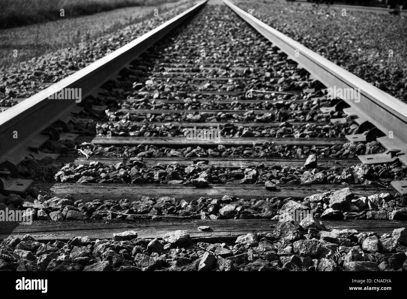 Dramatic black and white rendering of train tracks with diminishing ...