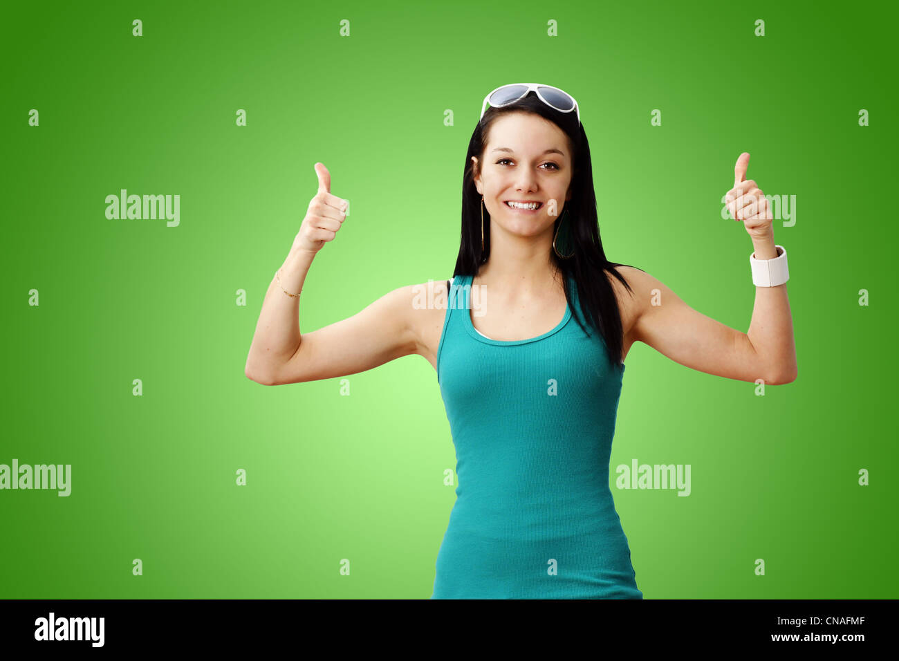 BEautiful young woman giving two thumbs up! Stock Photo - Alamy