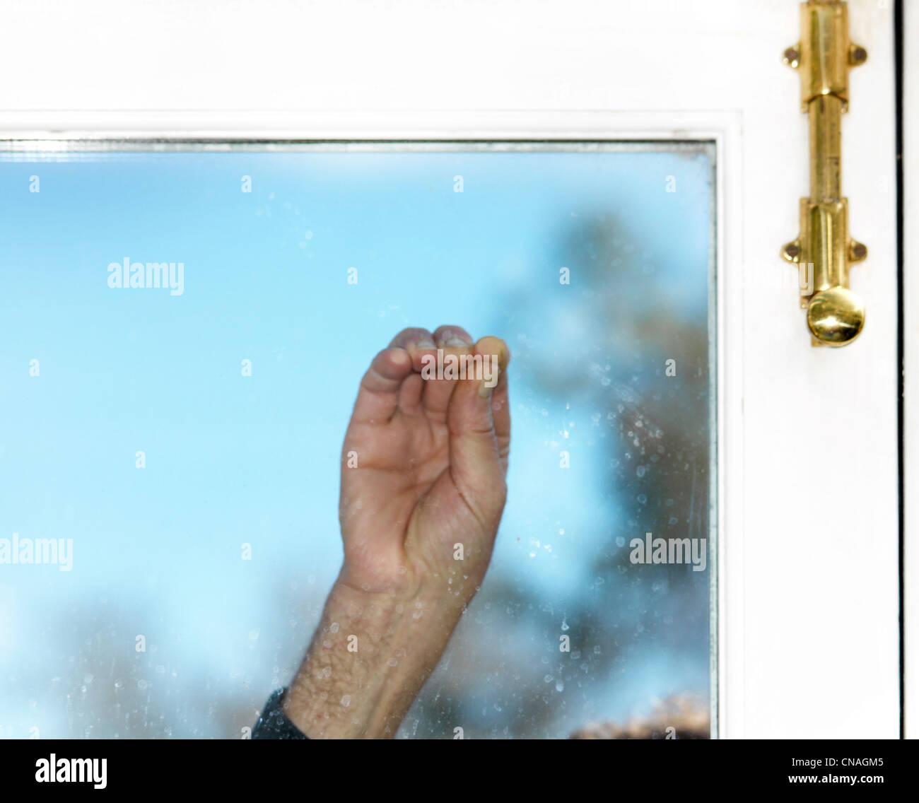 Fingers Tapping On Window Stock Photo - Alamy