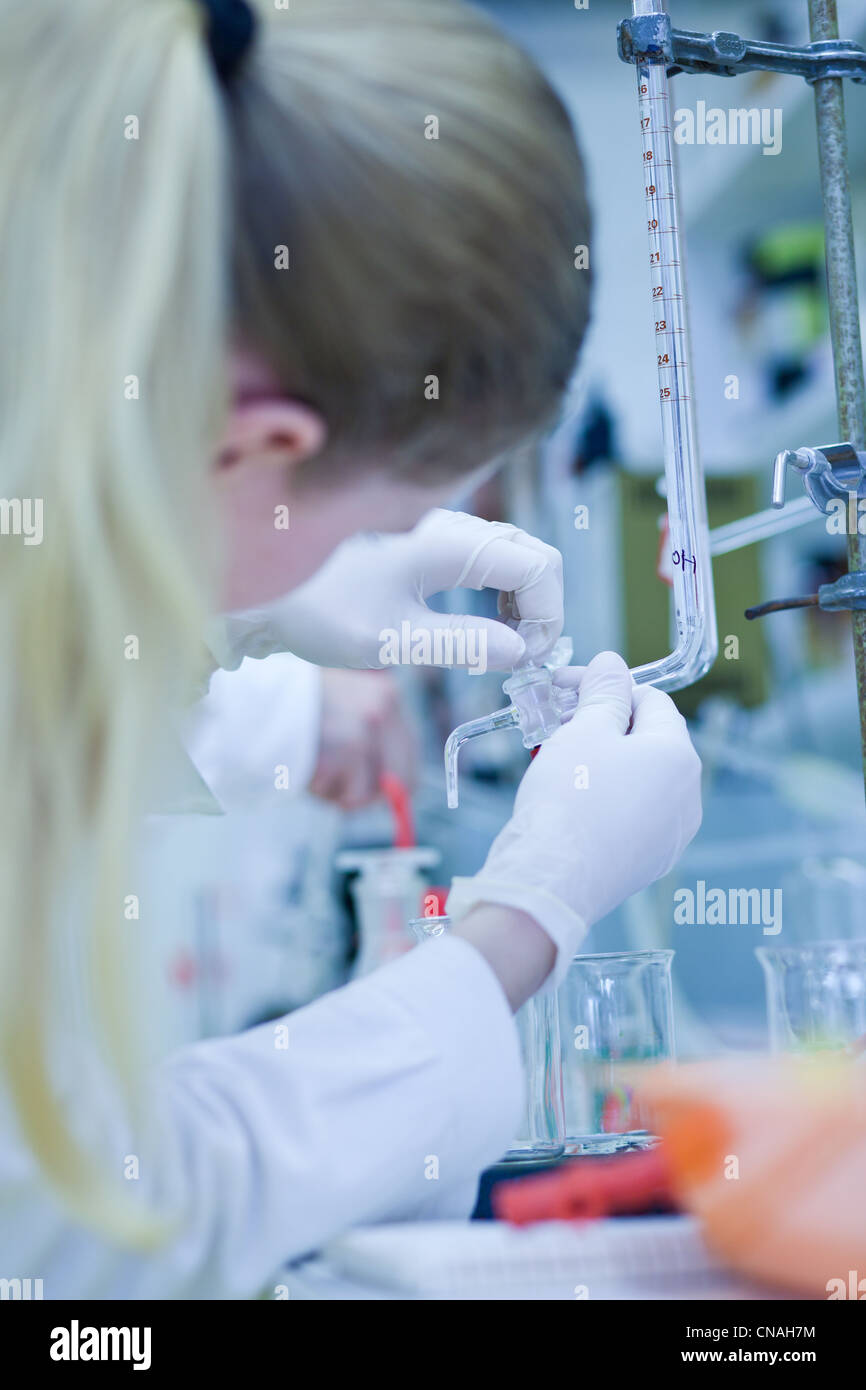 portrait of a female researcher carrying out research in a chemistry ...