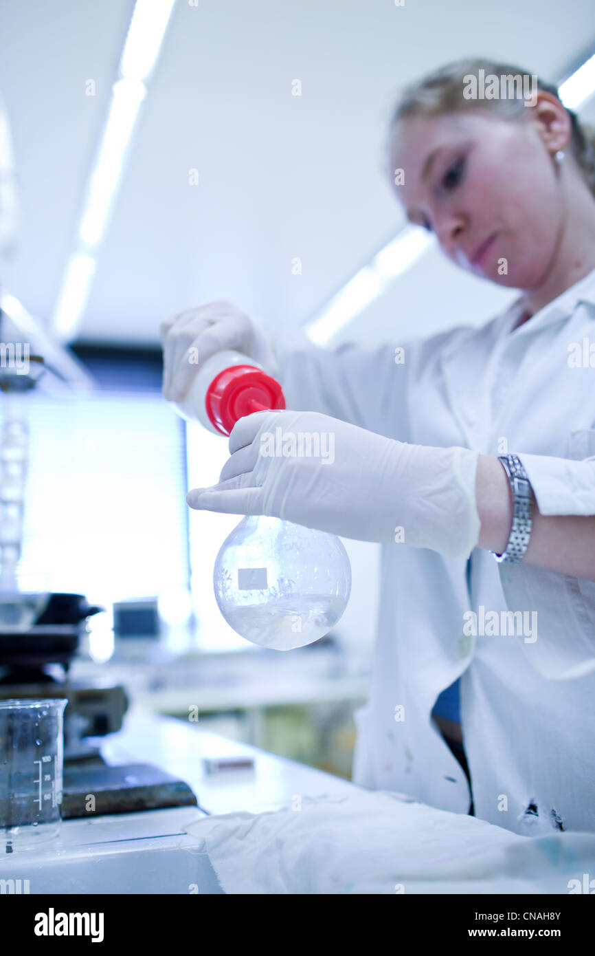 portrait of a female researcher carrying out research in a chemistry ...