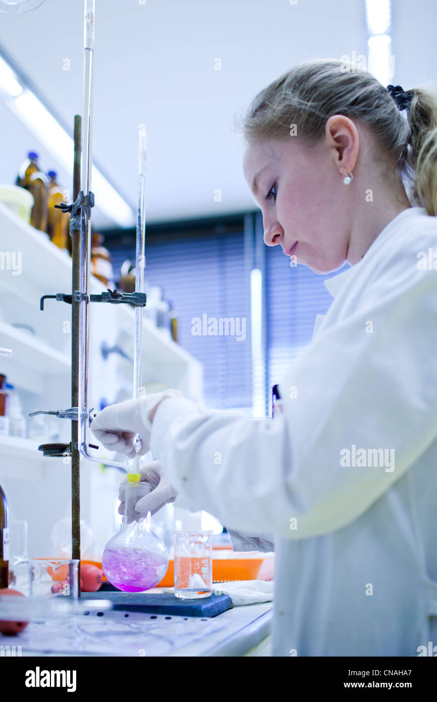 portrait of a female researcher carrying out research in a chemistry ...