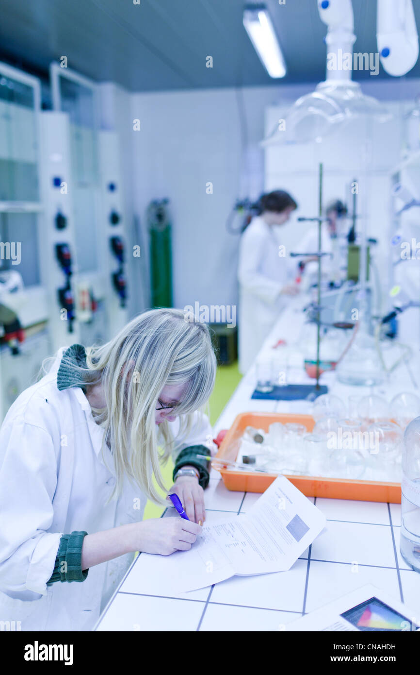 portrait of a female researcher carrying out research in a chemistry ...