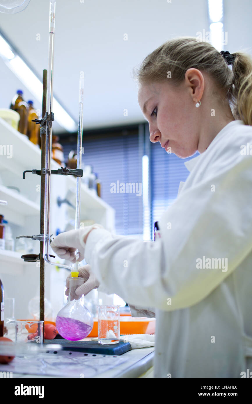 portrait of a female researcher doing research in a lab (color toned ...