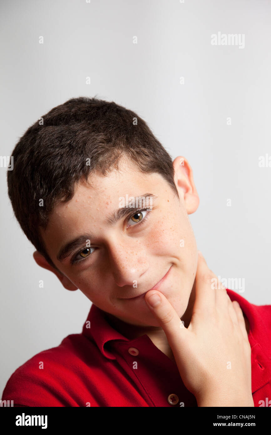 Teenage boy in thought, content expression Stock Photo - Alamy