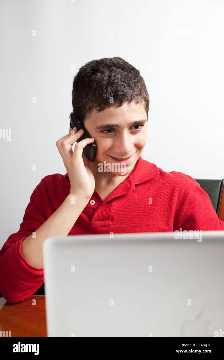 Teenager boy using laptop computer Stock Photo - Alamy