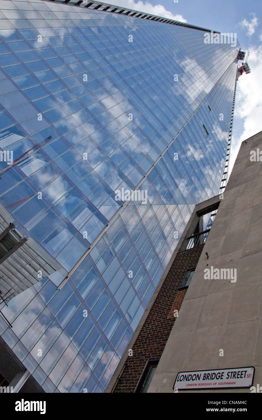 Looking up at spire of the London Shard with London Bridge Street sign ...