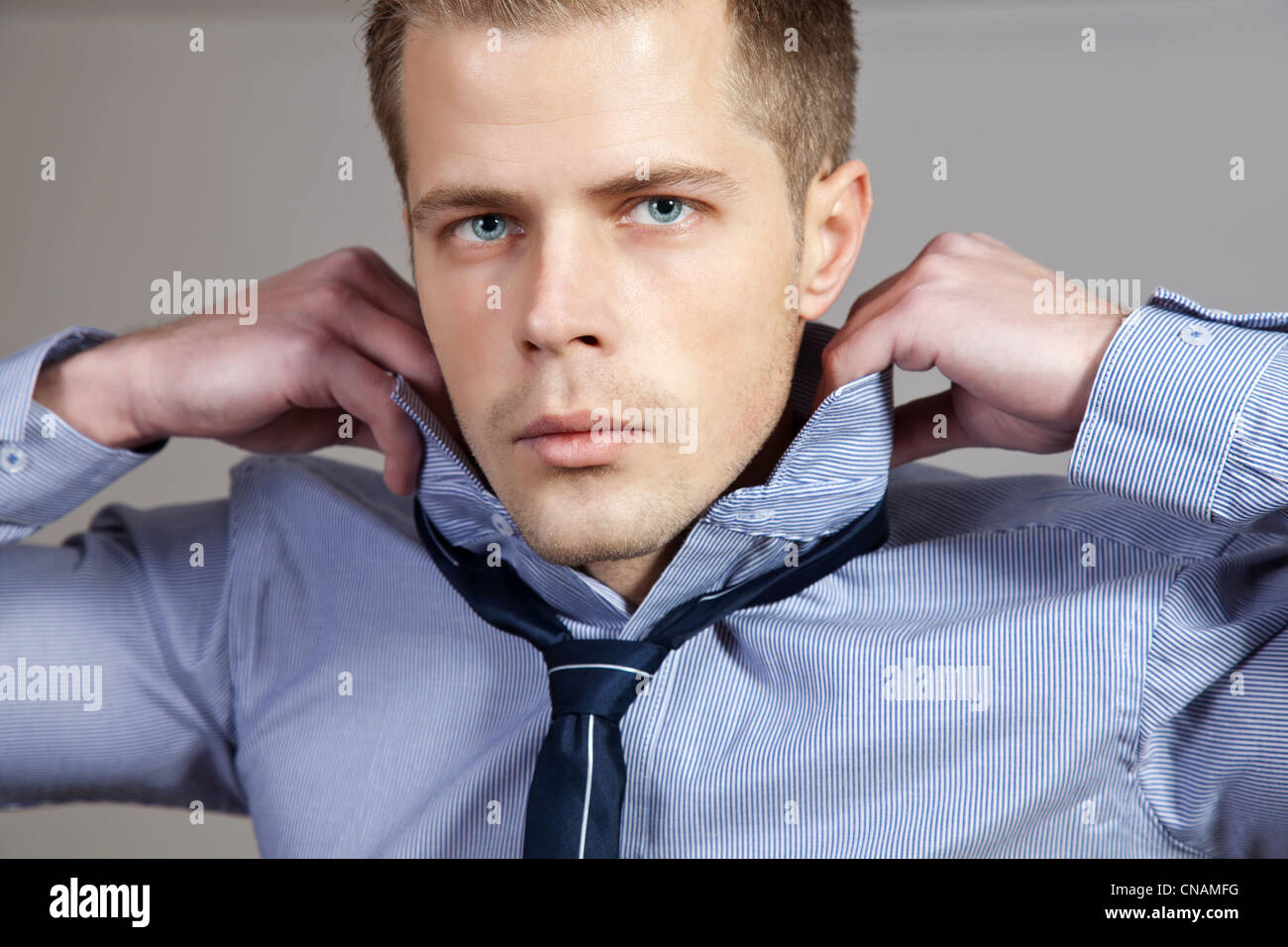 Adjusting tie interview hi-res stock photography and images - Alamy