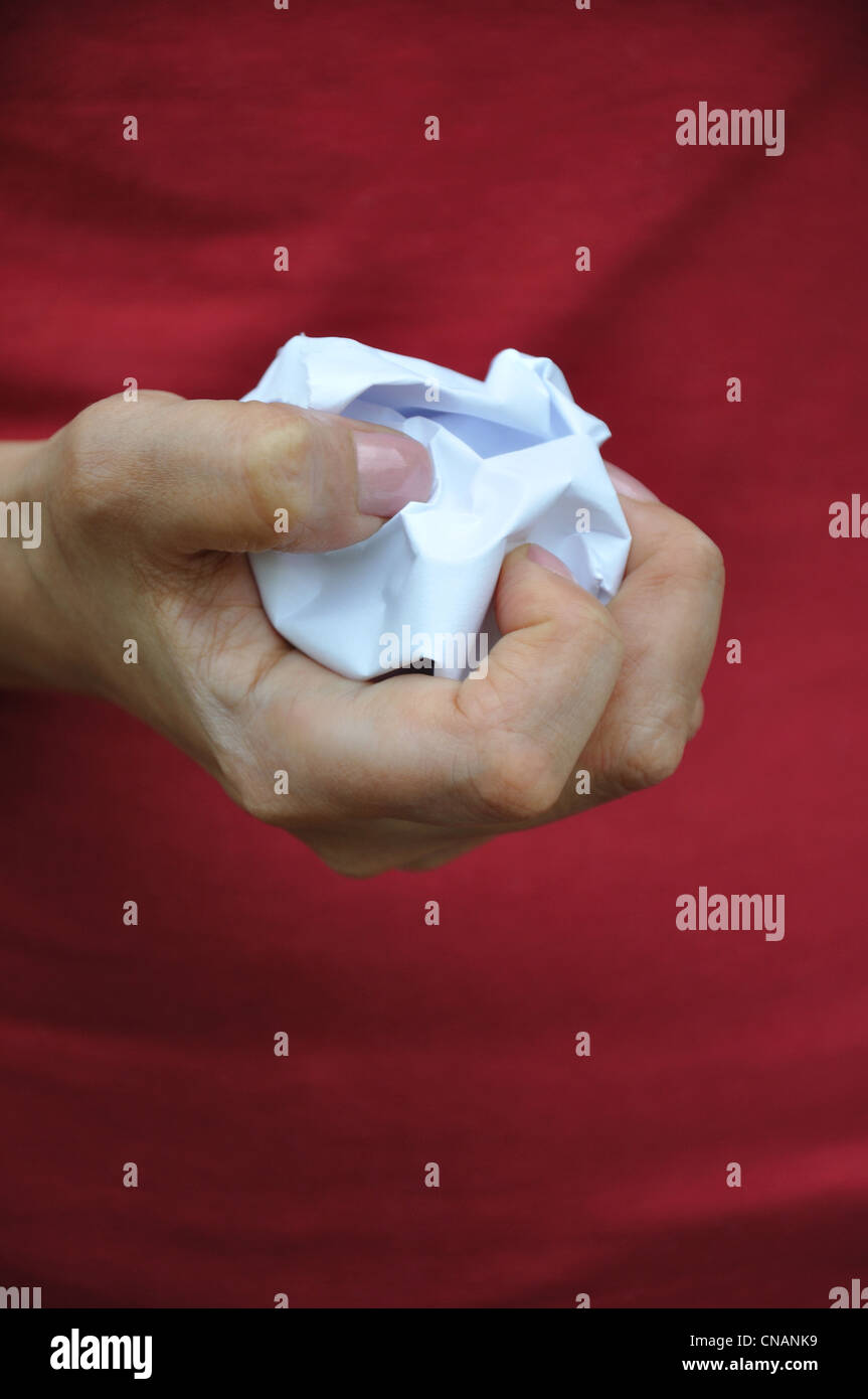 Hand crumpling paper Stock Photo - Alamy