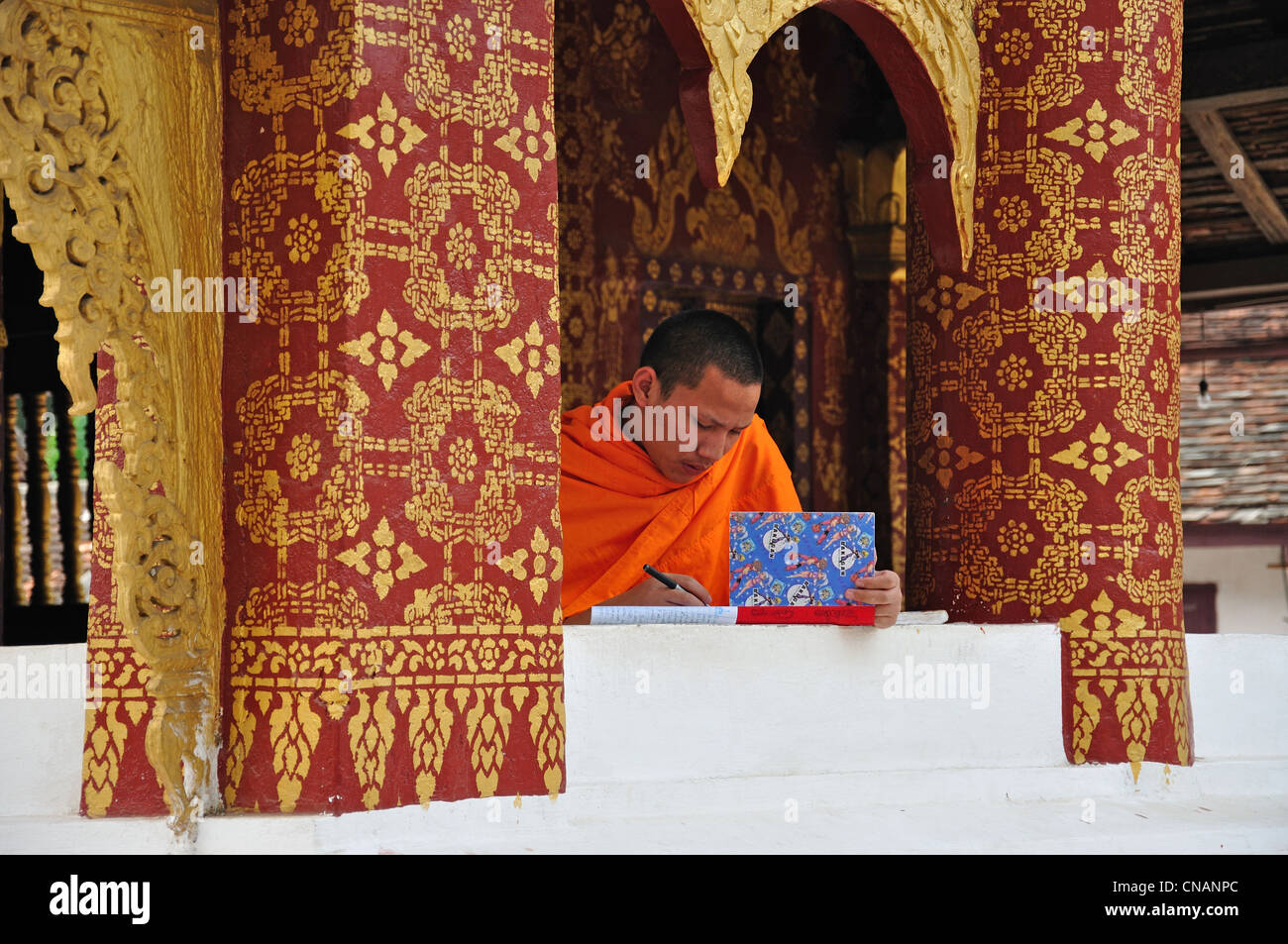 Buddhist monk writing hi-res stock photography and images - Alamy