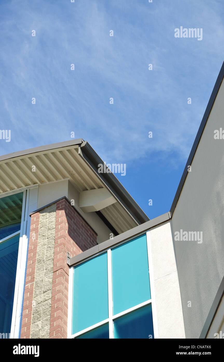 One side of building view with blue sky Stock Photo - Alamy