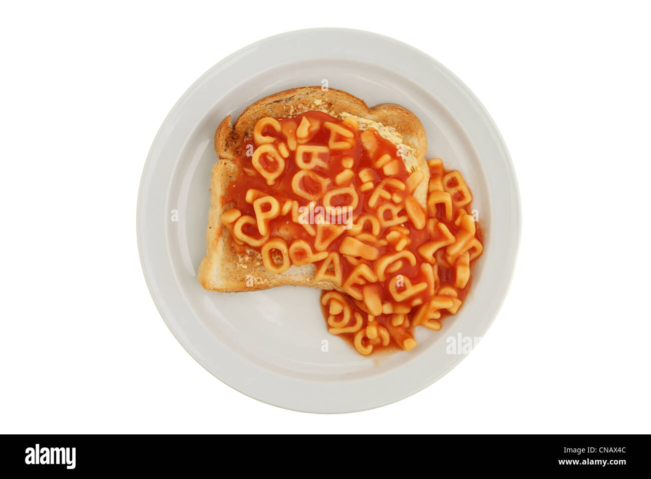 Child's meal alphabet spaghetti on toast on a plate isolated against ...