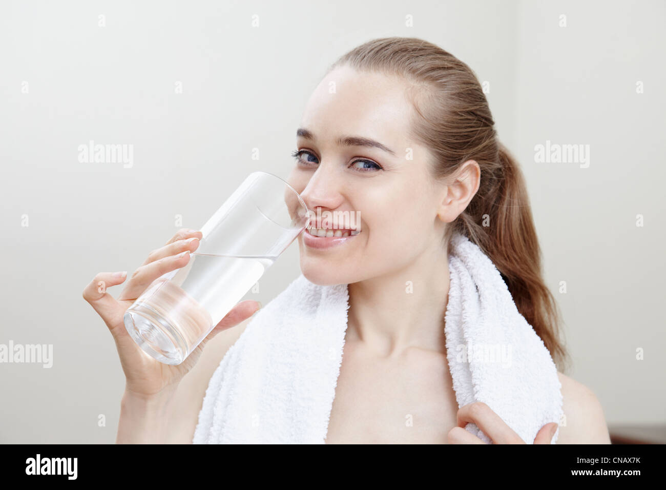 Woman drinking glass of water Stock Photo - Alamy
