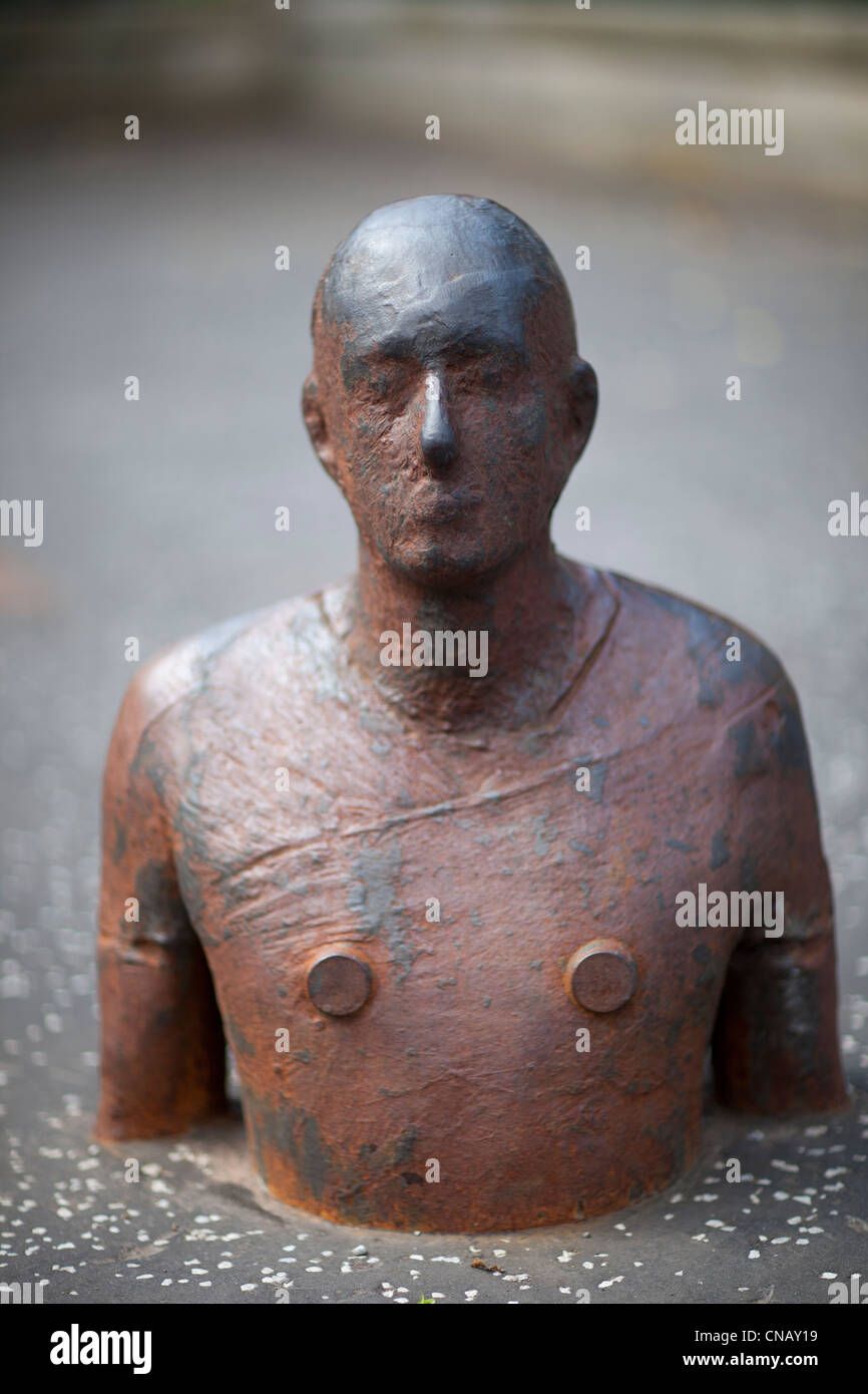 Modern sculpture of bust on city street Stock Photo - Alamy