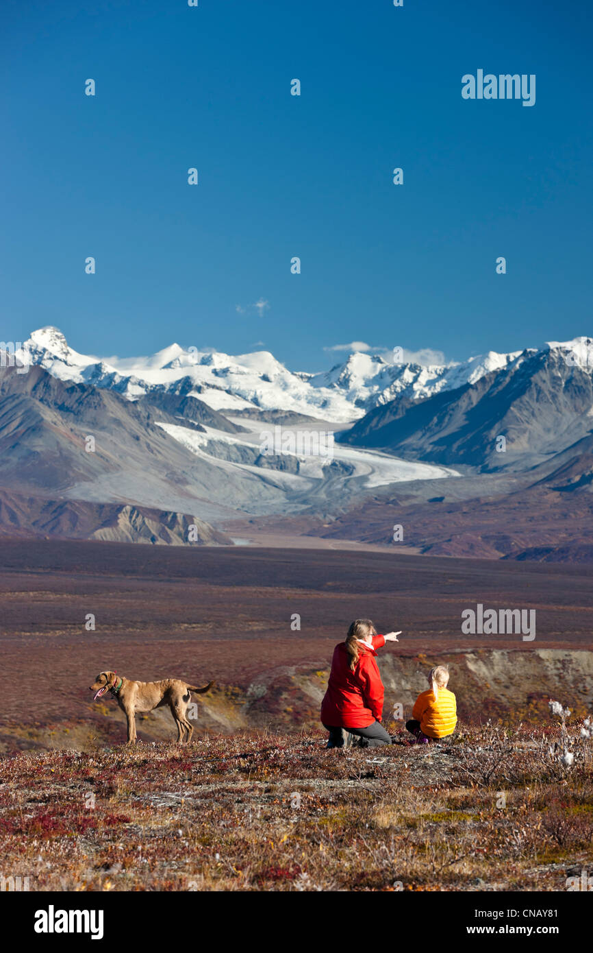 Mother and daughter enjoy the view of Summit Lake and the Alaska Range ...