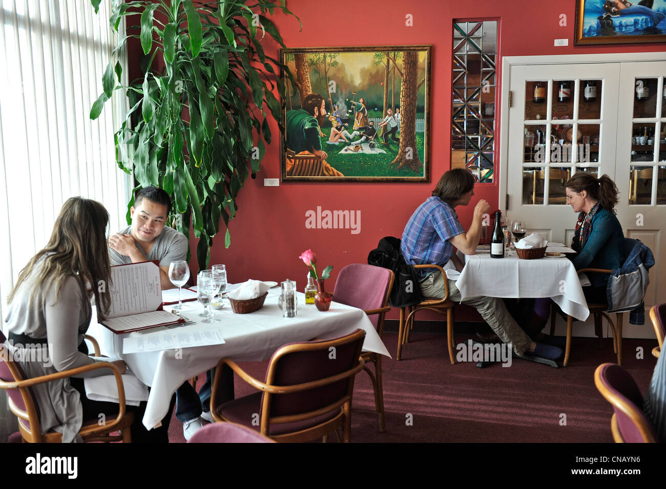 Customers dining at tables in Jens' Restaurant in Anchorage ...