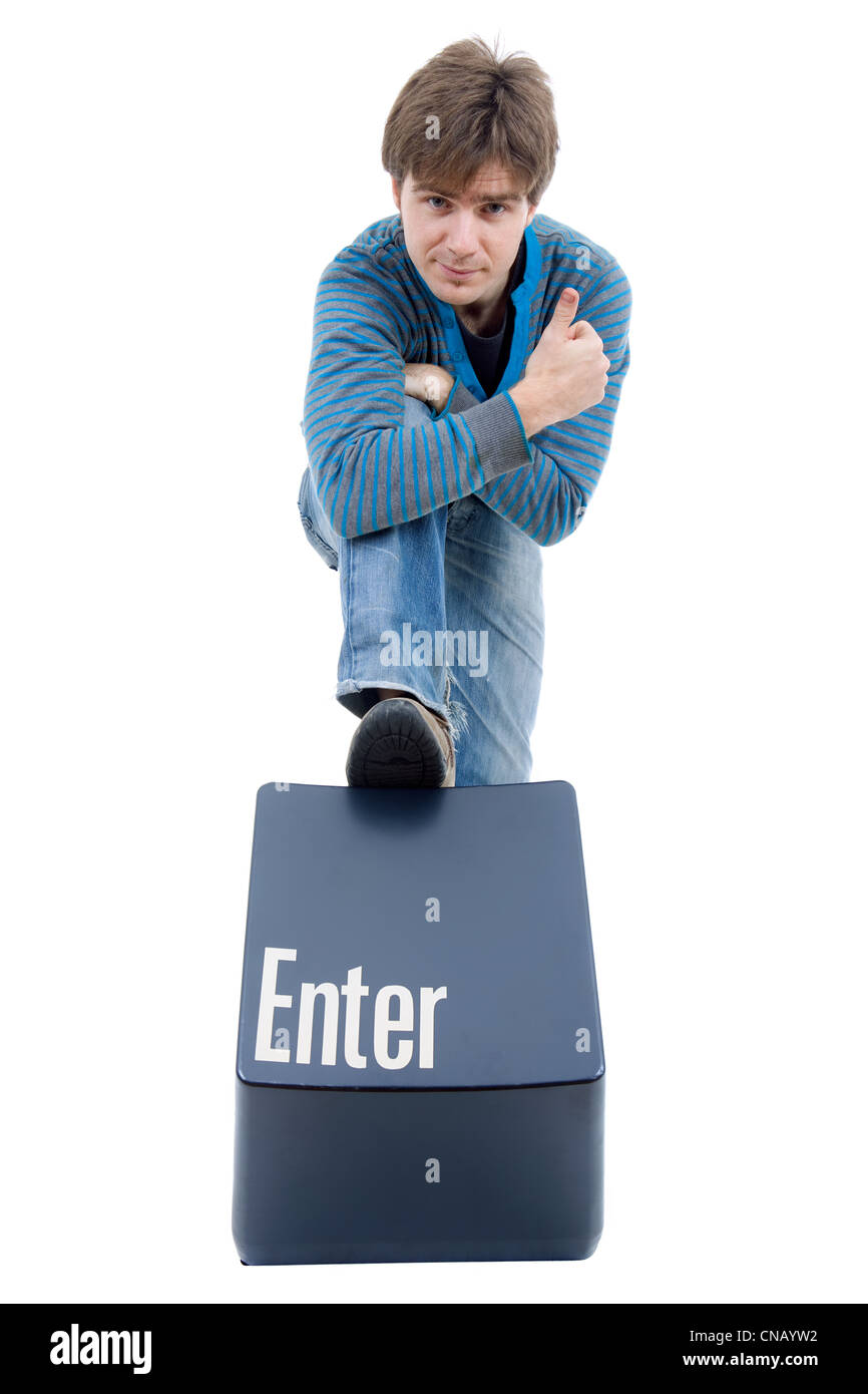 young casual man with the enter key Stock Photo - Alamy