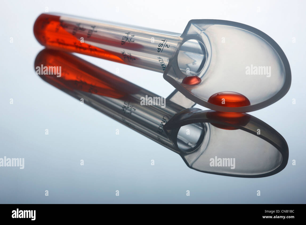 Cough syrup measuring spoon hi-res stock photography and images - Alamy