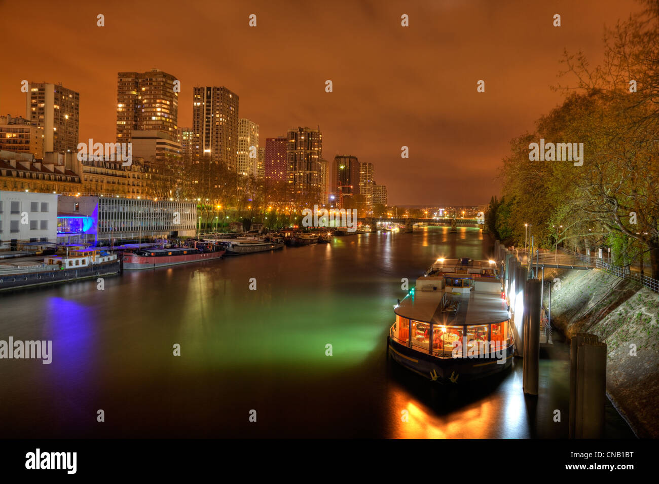 Night image of the modern district of Grenelle and the river Seine in ...