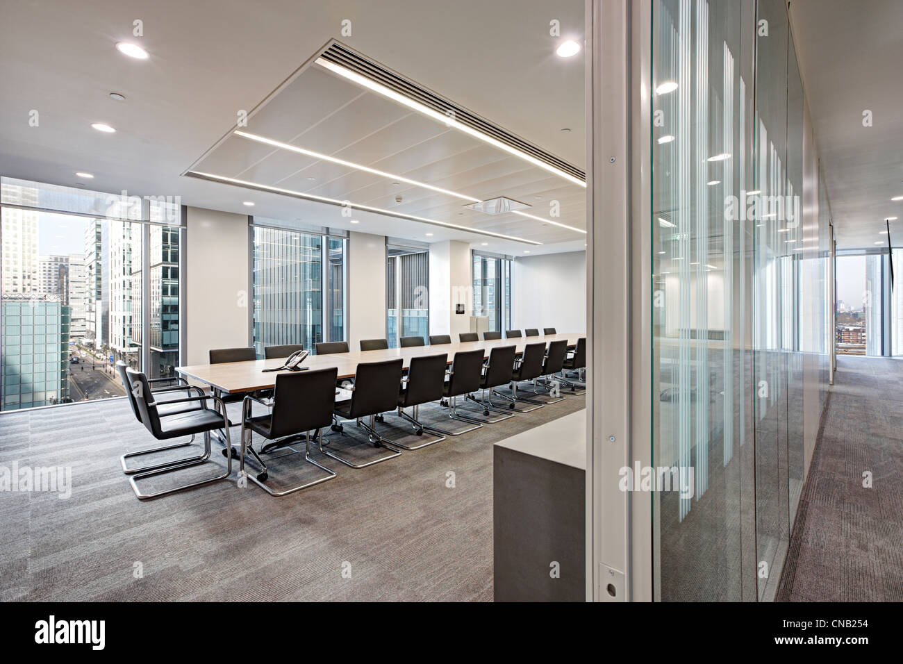 board room meeting room large table screen chairs Stock Photo - Alamy