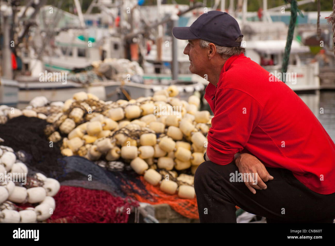 Commercial salmon fisherman in thoughtful pose on salmon seiner, Saint ...
