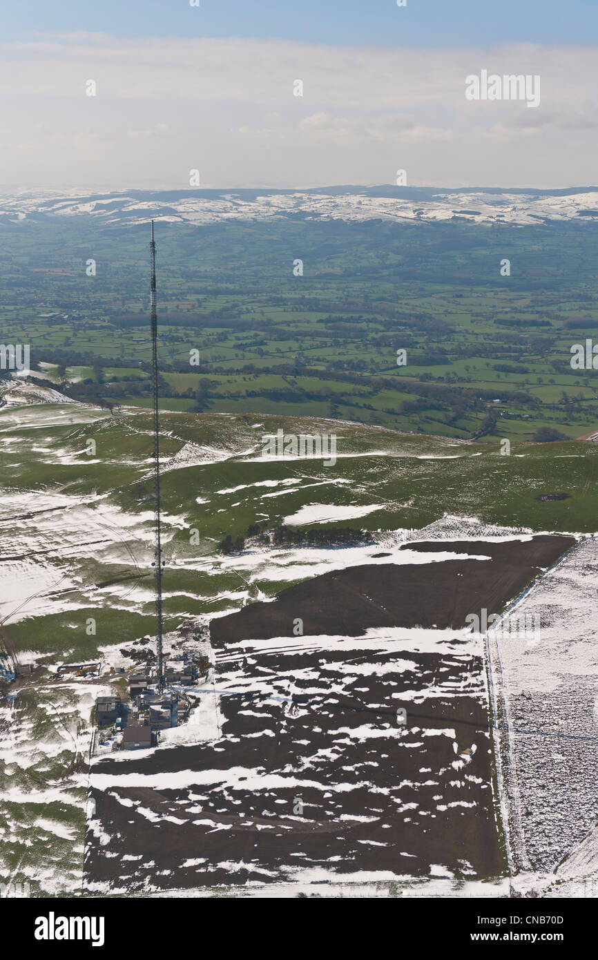 Aerial View showing patchy snow on the hills and a radio aerial in the ...