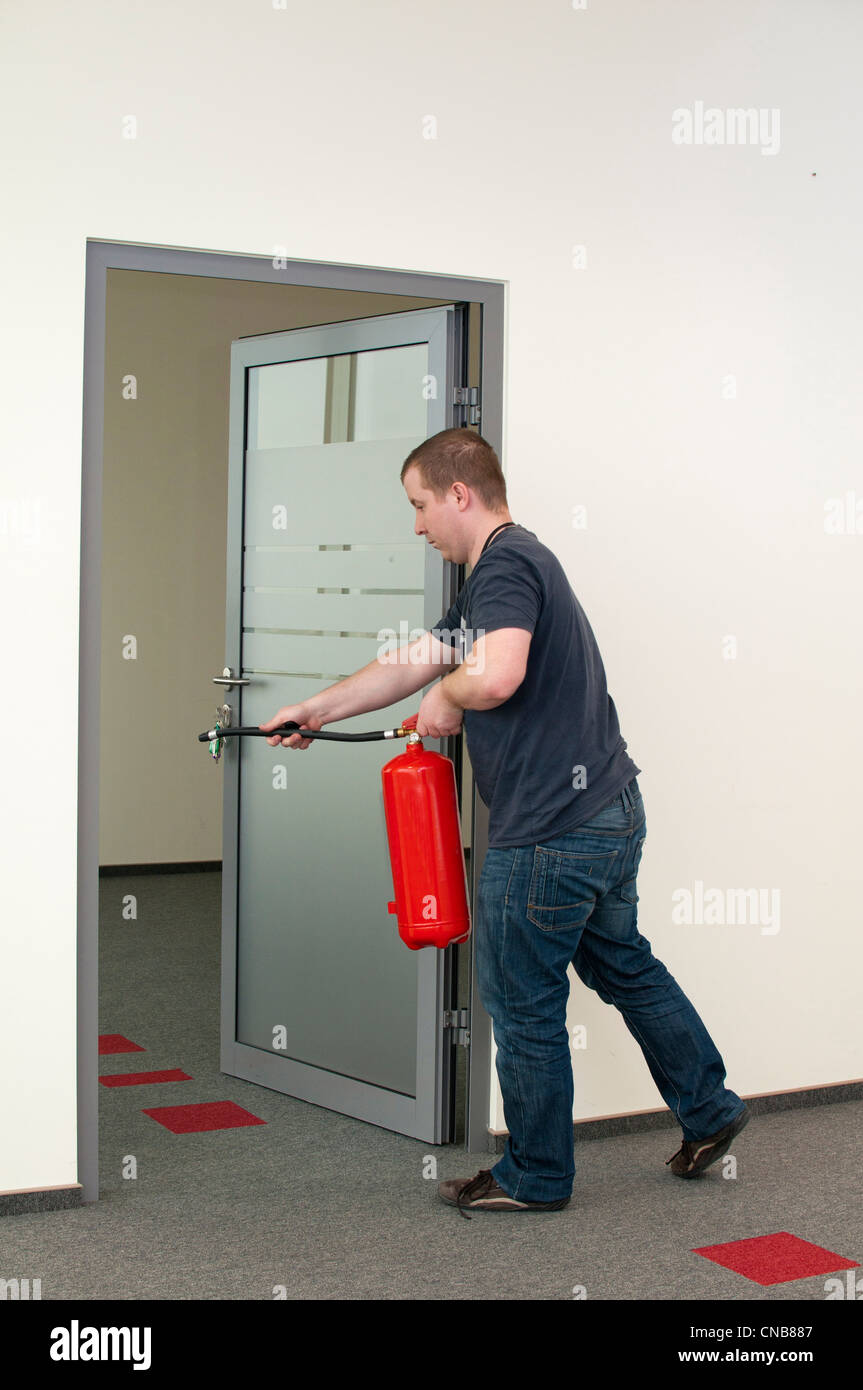 Hand man fire extinguisher hi-res stock photography and images - Alamy