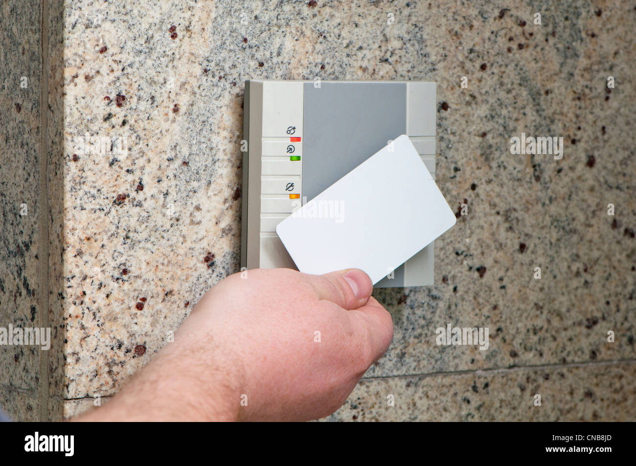 man puts the card into the reader access Stock Photo - Alamy