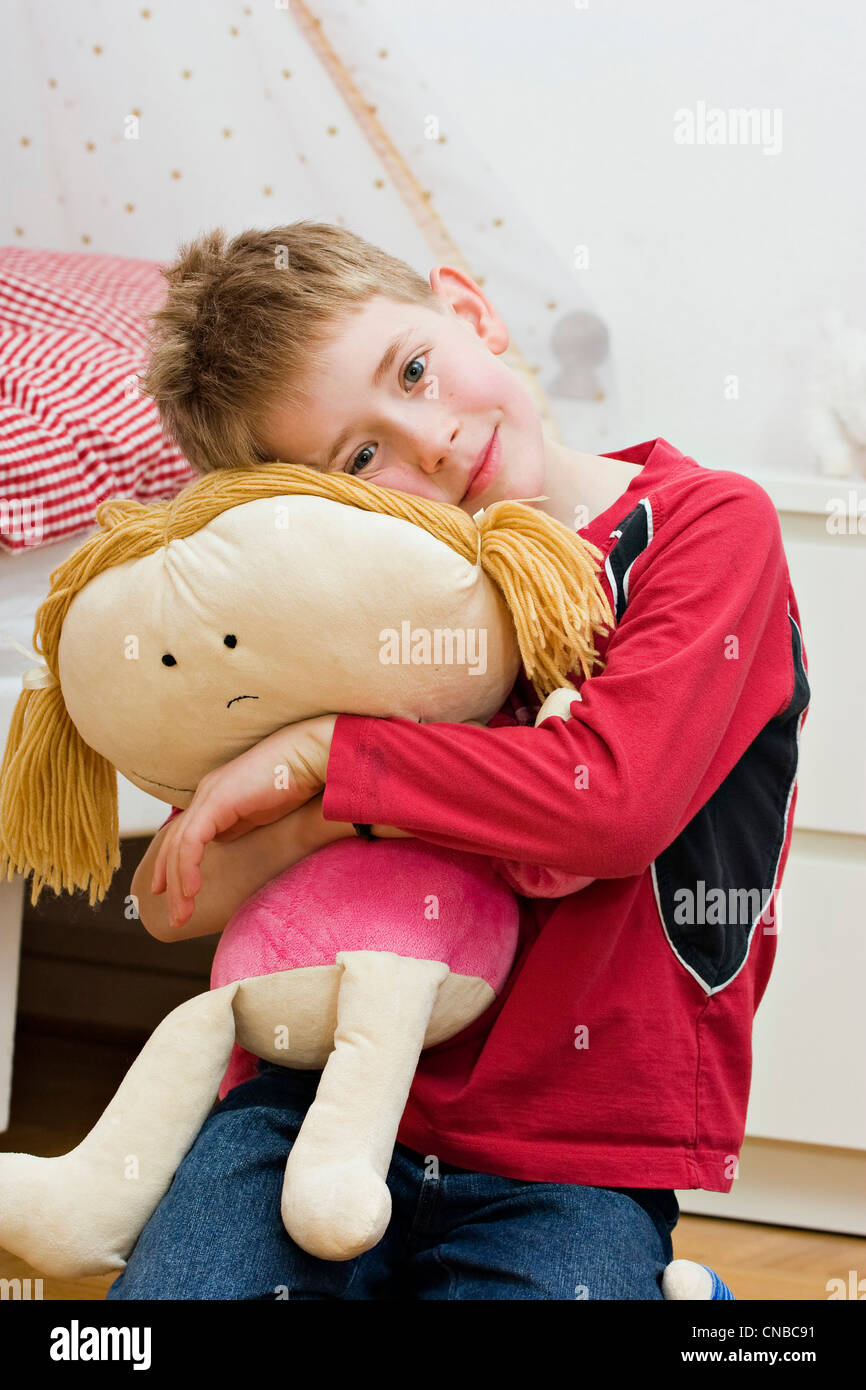 Boy plays doll hi-res stock photography and images - Alamy