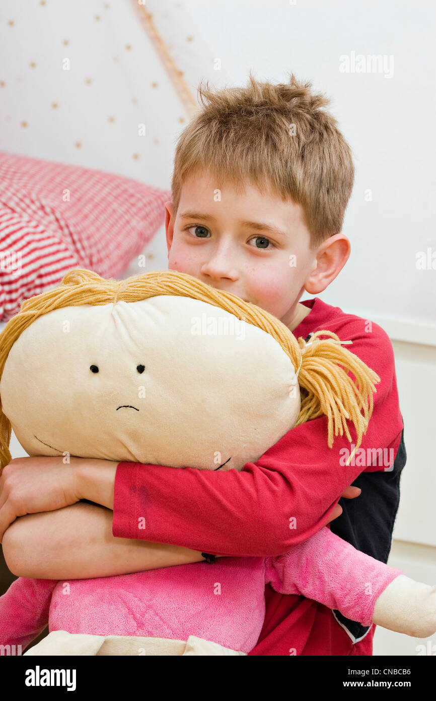 Boy plays doll hi-res stock photography and images - Alamy