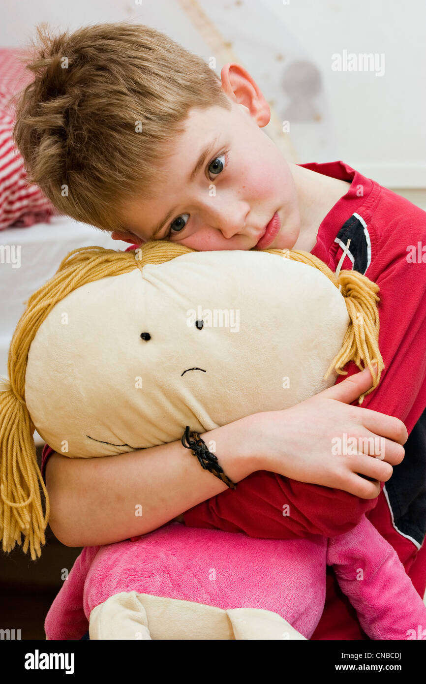 Boy plays doll hi-res stock photography and images - Alamy