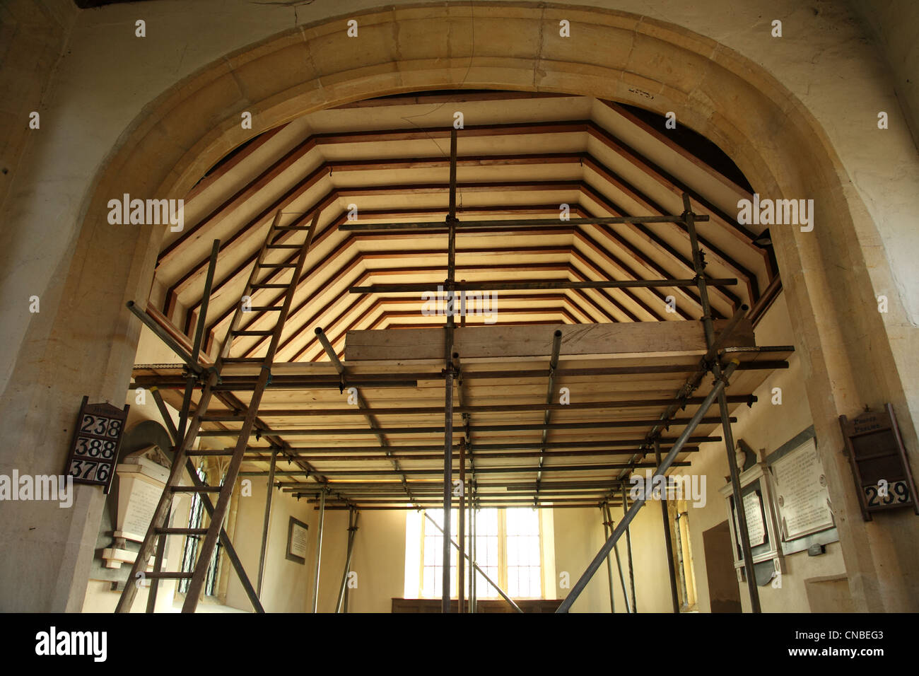 Church repairs - scaffolding and ladders in a tiny rural church as ...