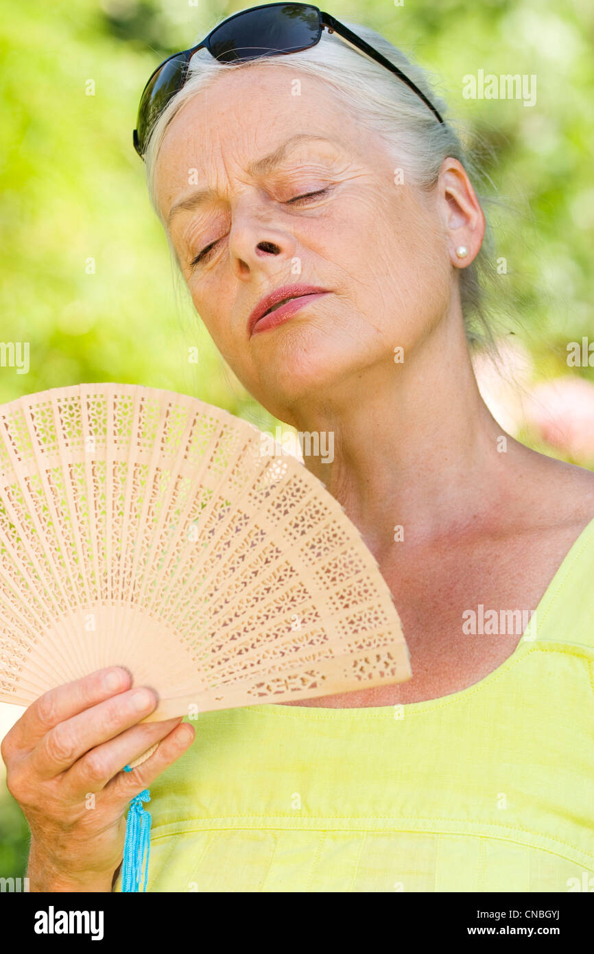 Lady fanning herself hi-res stock photography and images - Alamy