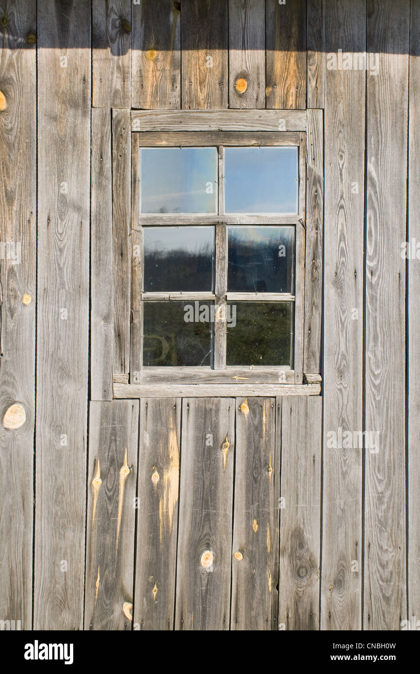 Rustic home with window reflection Stock Photo - Alamy