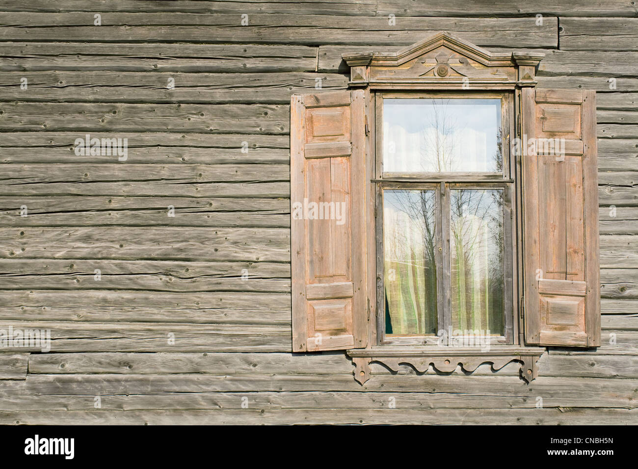 Rustic home with window reflection Stock Photo - Alamy