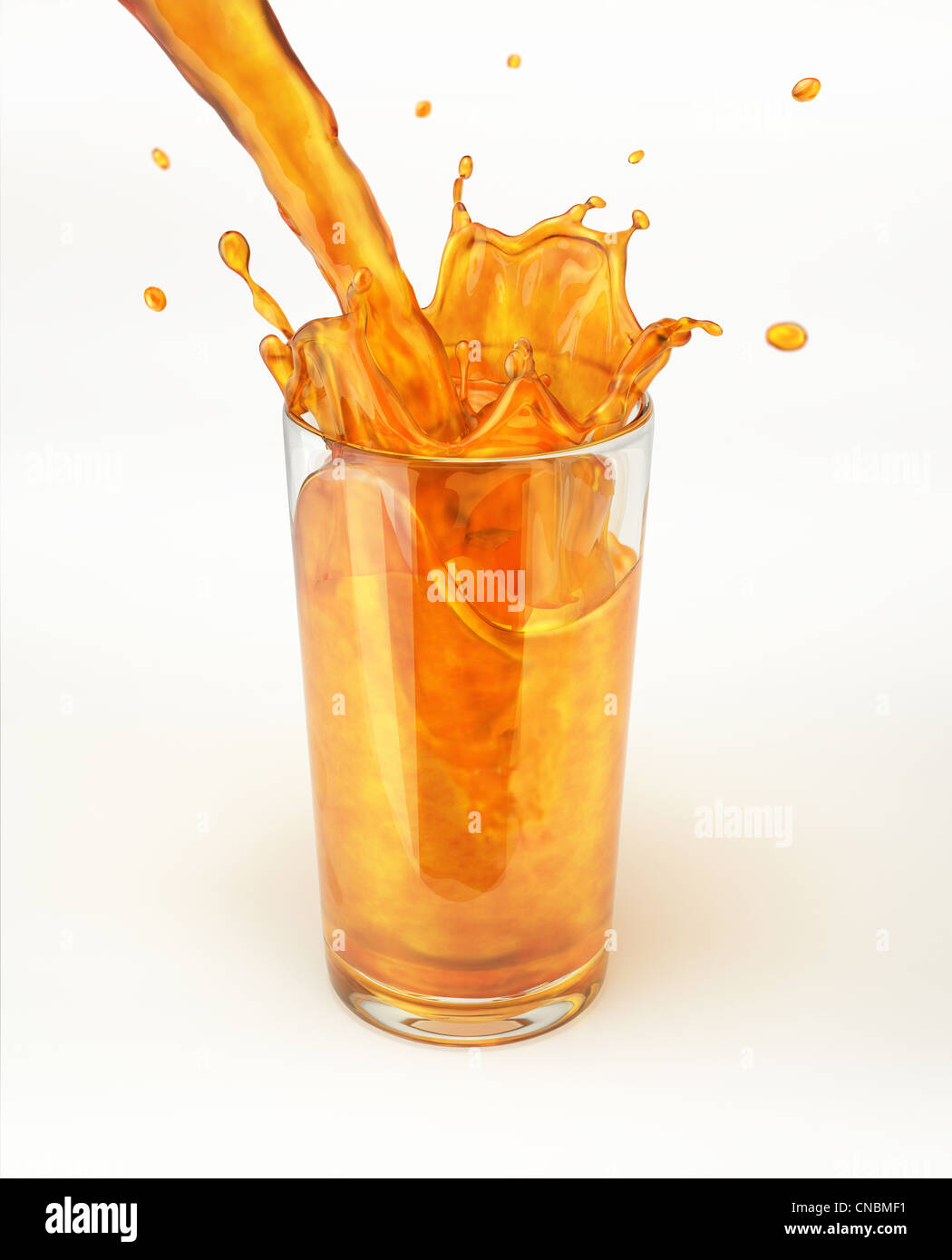 Orange juice pouring into a glass, forming a splash. On white ...