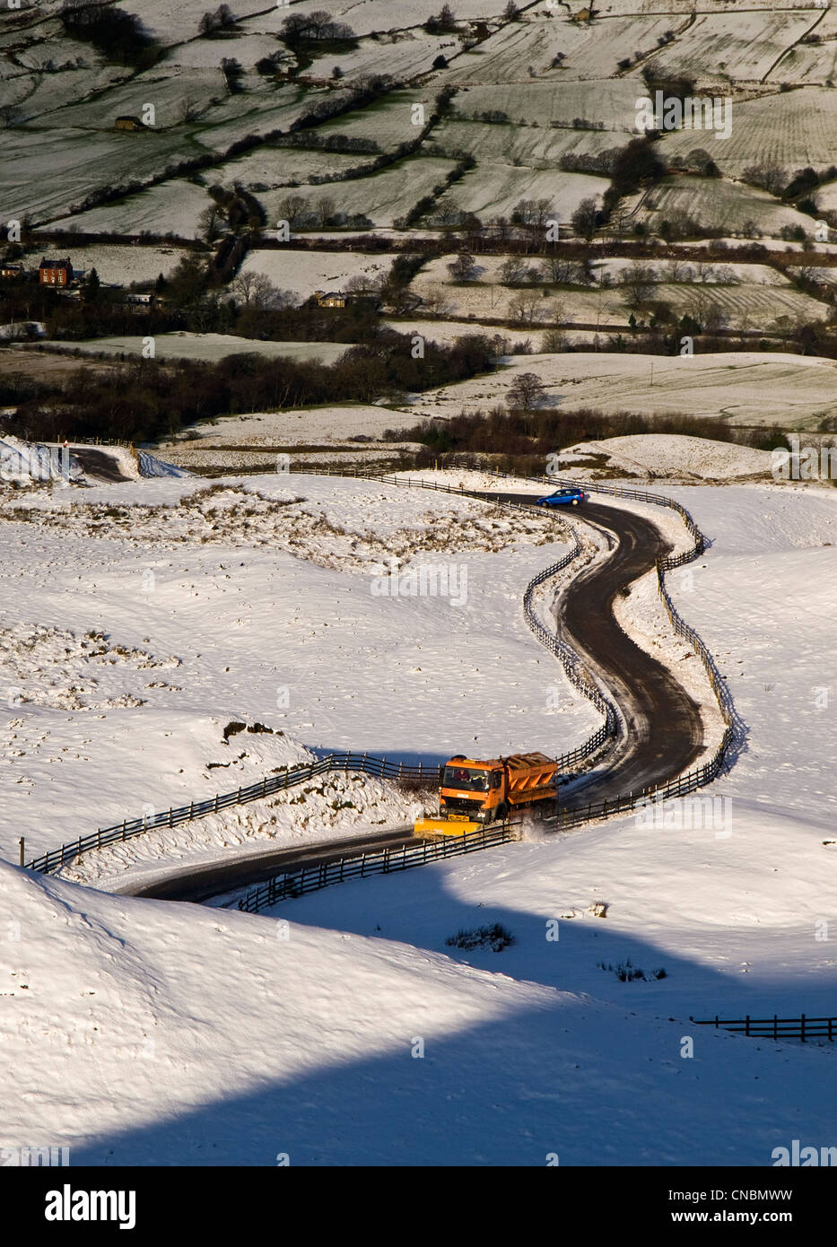 A snow plough clearing the road out of Edale towards Mam Tor Stock ...