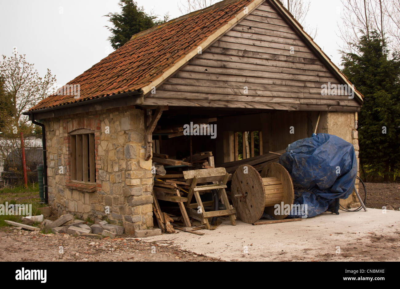 re-built old stone wood barn on farm in somerset Stock Photo - Alamy