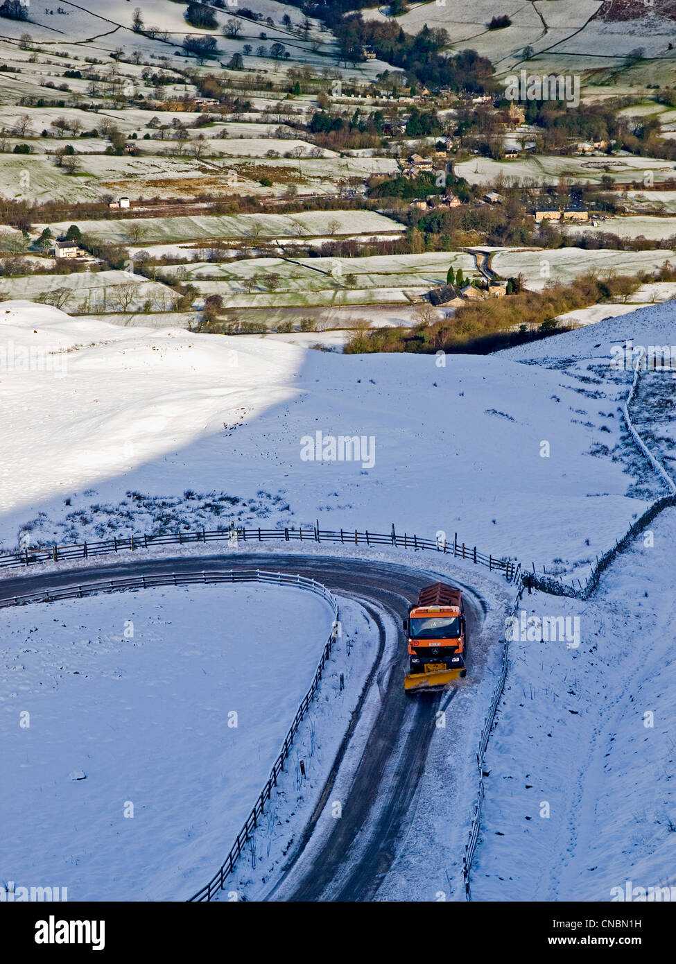 A snow plough clearing the road out of Edale towards Mam Tor Stock ...