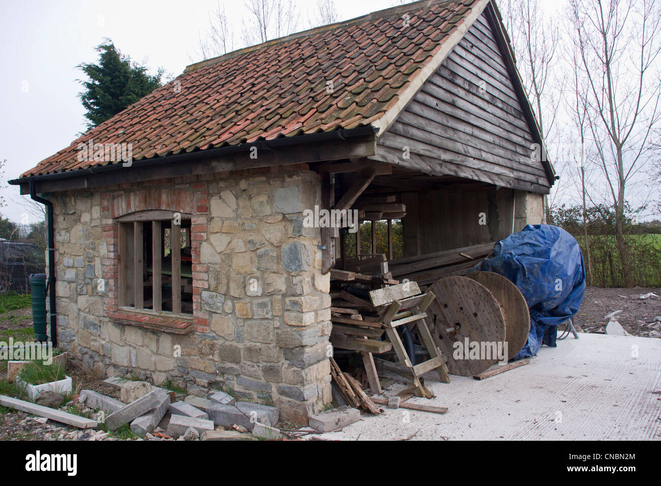 re-built old stone wood barn on farm in somerset Stock Photo - Alamy