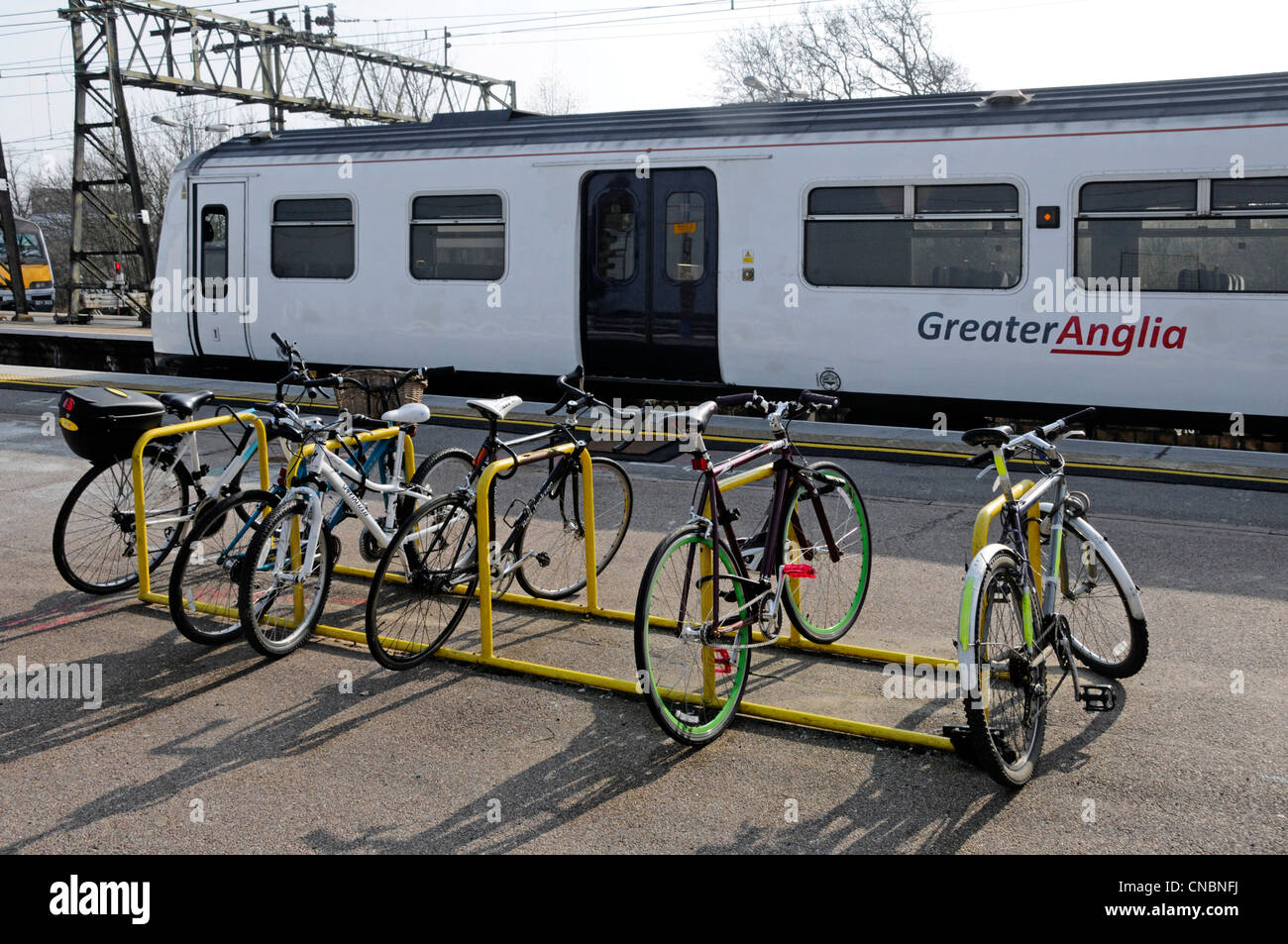 Greater Anglia train service at station platform with cycle storage ...