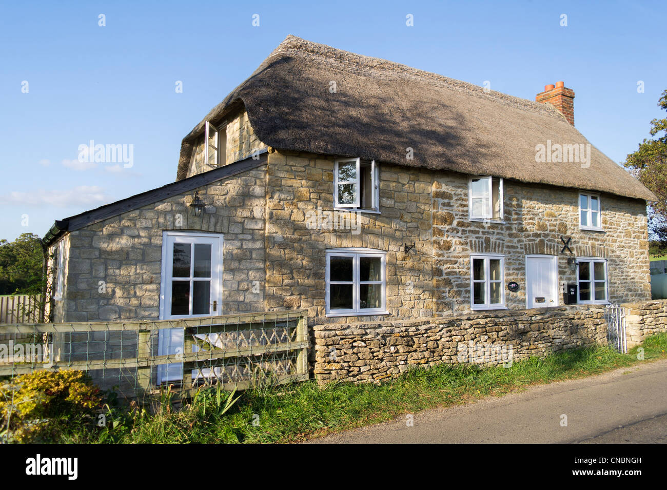 Restored and Extended Dorset Thatched Stone Cottage Stock Photo - Alamy