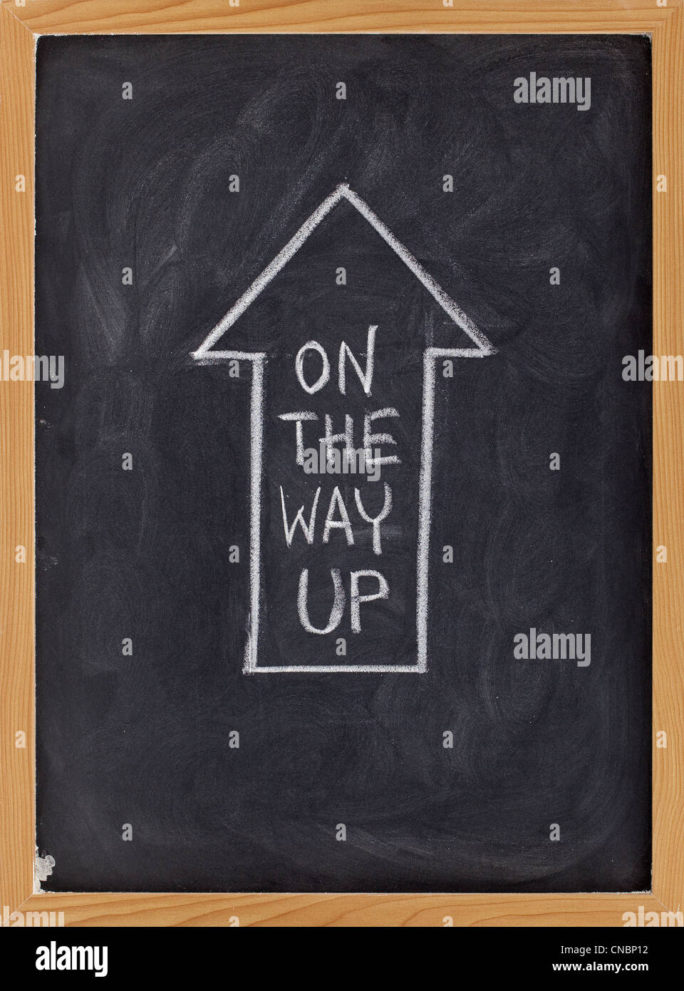on the way up concept on blackboard - white chalk handwriting inside ...