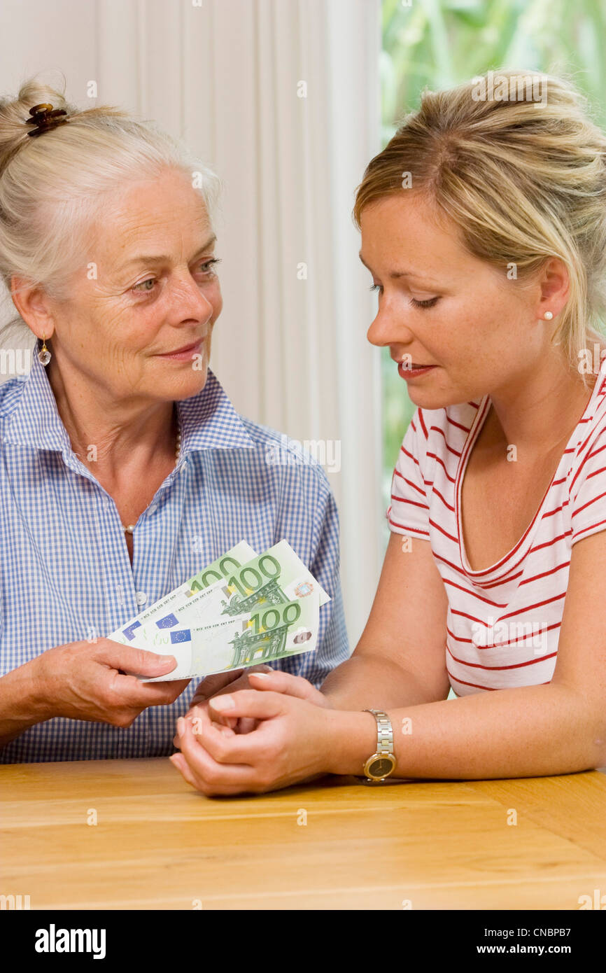 Woman Handing Cash Over High Resolution Stock Photography and Images ...