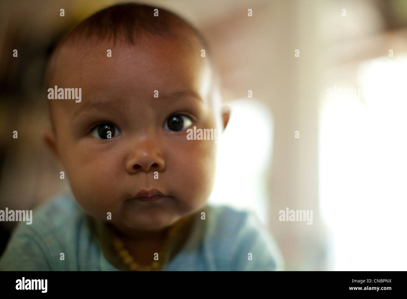 baby with a discovering look Stock Photo - Alamy