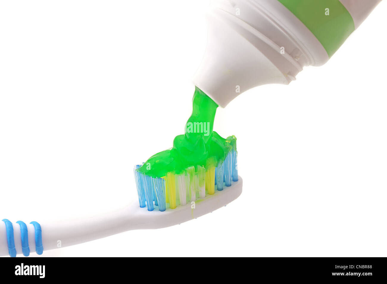 Toothpaste coming out of a tube on Toothbrush on white background Stock ...