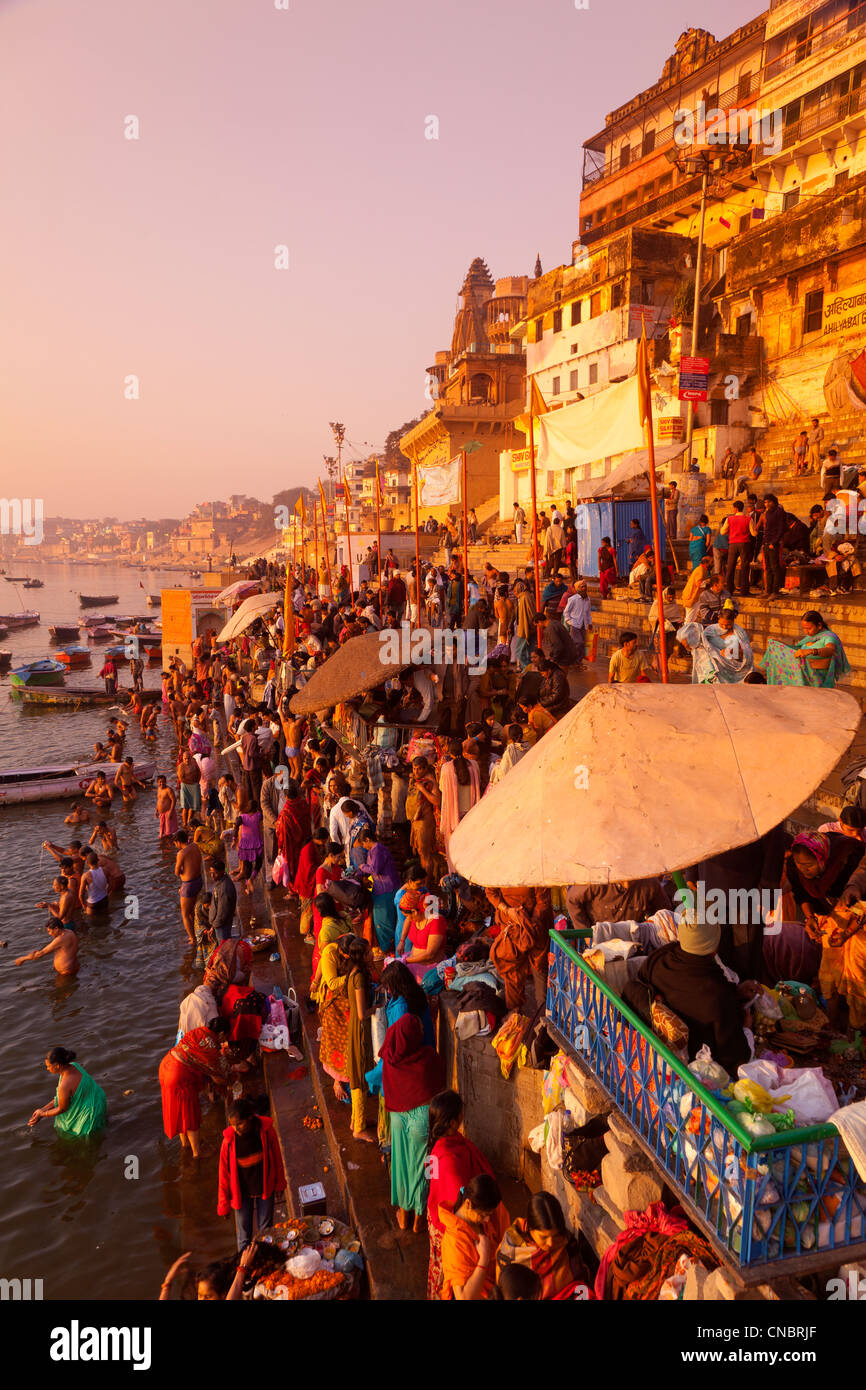 India, Uttar Pradesh, Varanasi, Pilgrims bathing and praying in the ...