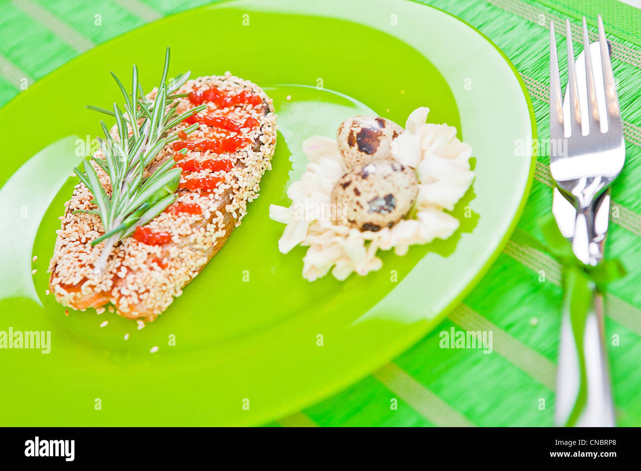fish with sesame on a green plate Stock Photo - Alamy